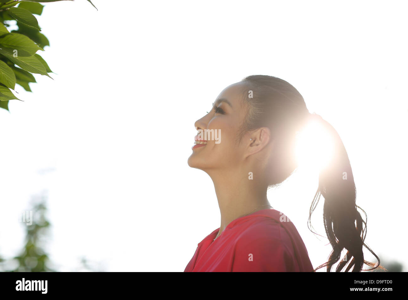 Young woman under the sunshine Stock Photo - Alamy