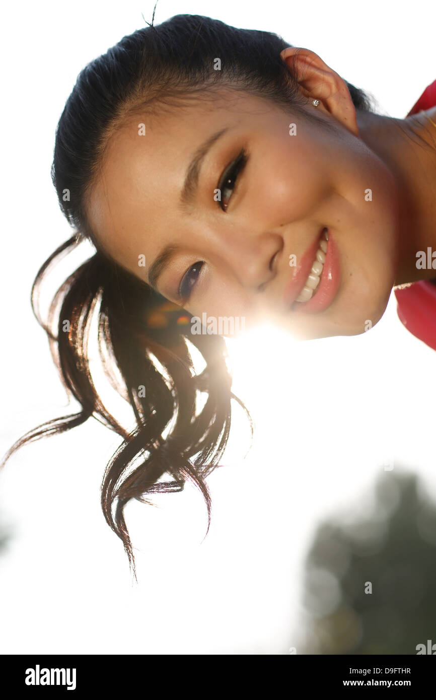 Young woman under the sunshine Stock Photo - Alamy