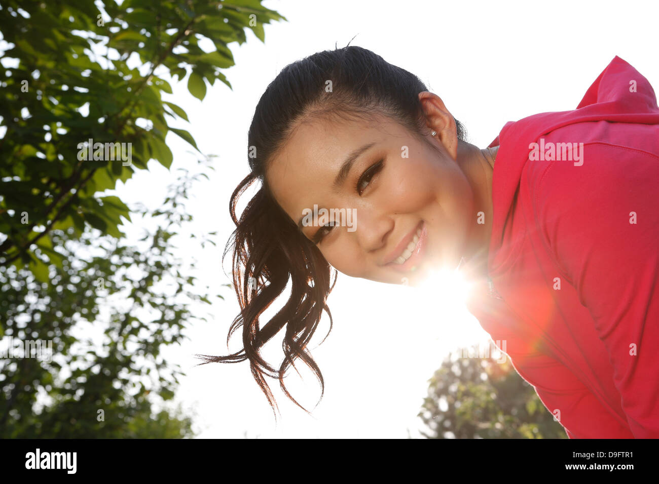 Young woman under the sunshine Stock Photo - Alamy