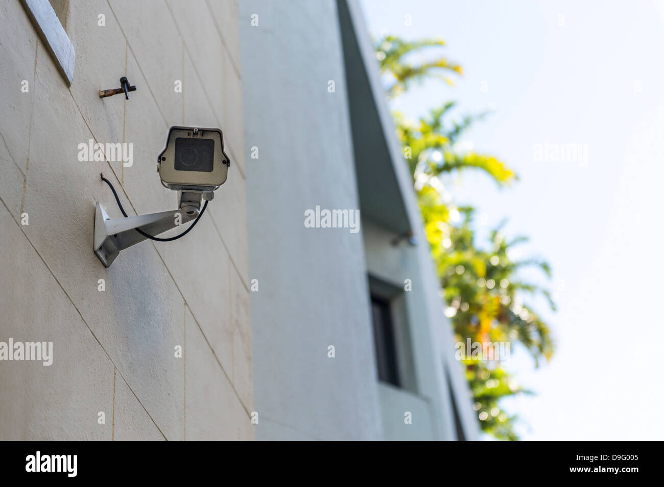 Low angle view of a CCTV camera mounted on a wall Stock Photo - Alamy