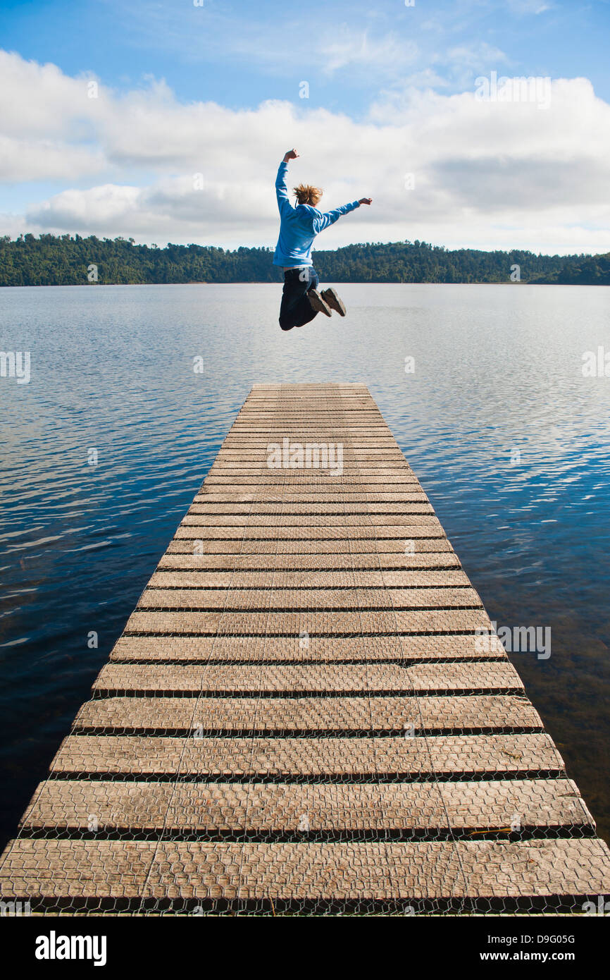 Person jumping into a lake hi-res stock photography and images - Alamy