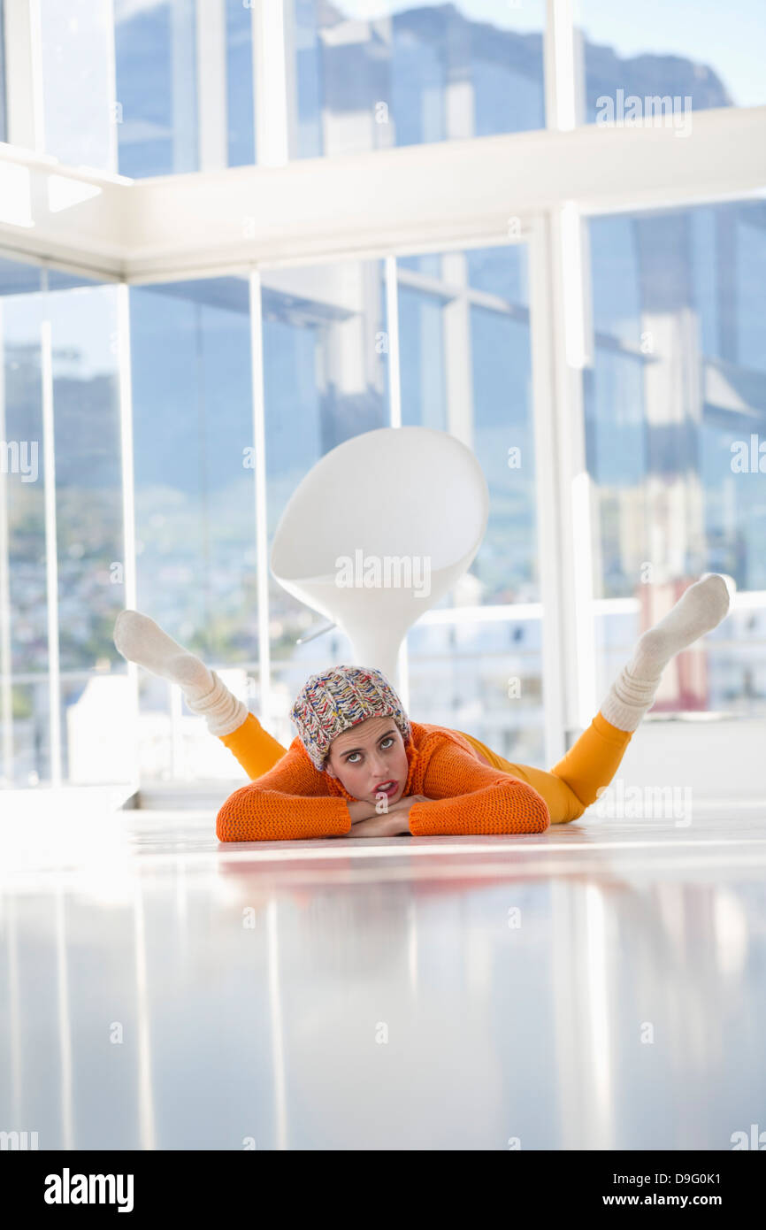 Woman lying on the floor Stock Photo - Alamy
