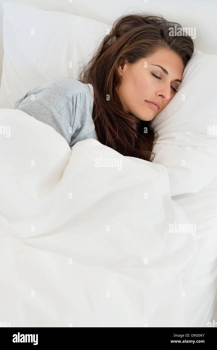 Woman sleeping on the bed Stock Photo - Alamy