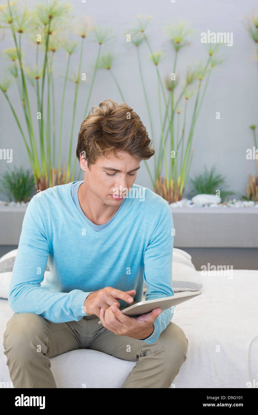 Man using a digital tablet Stock Photo - Alamy