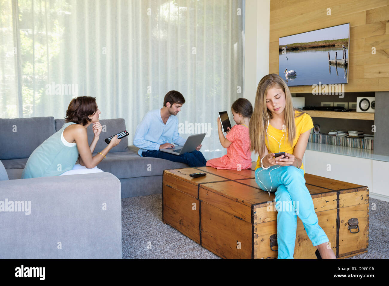 Family using electronics gadgets Stock Photo - Alamy
