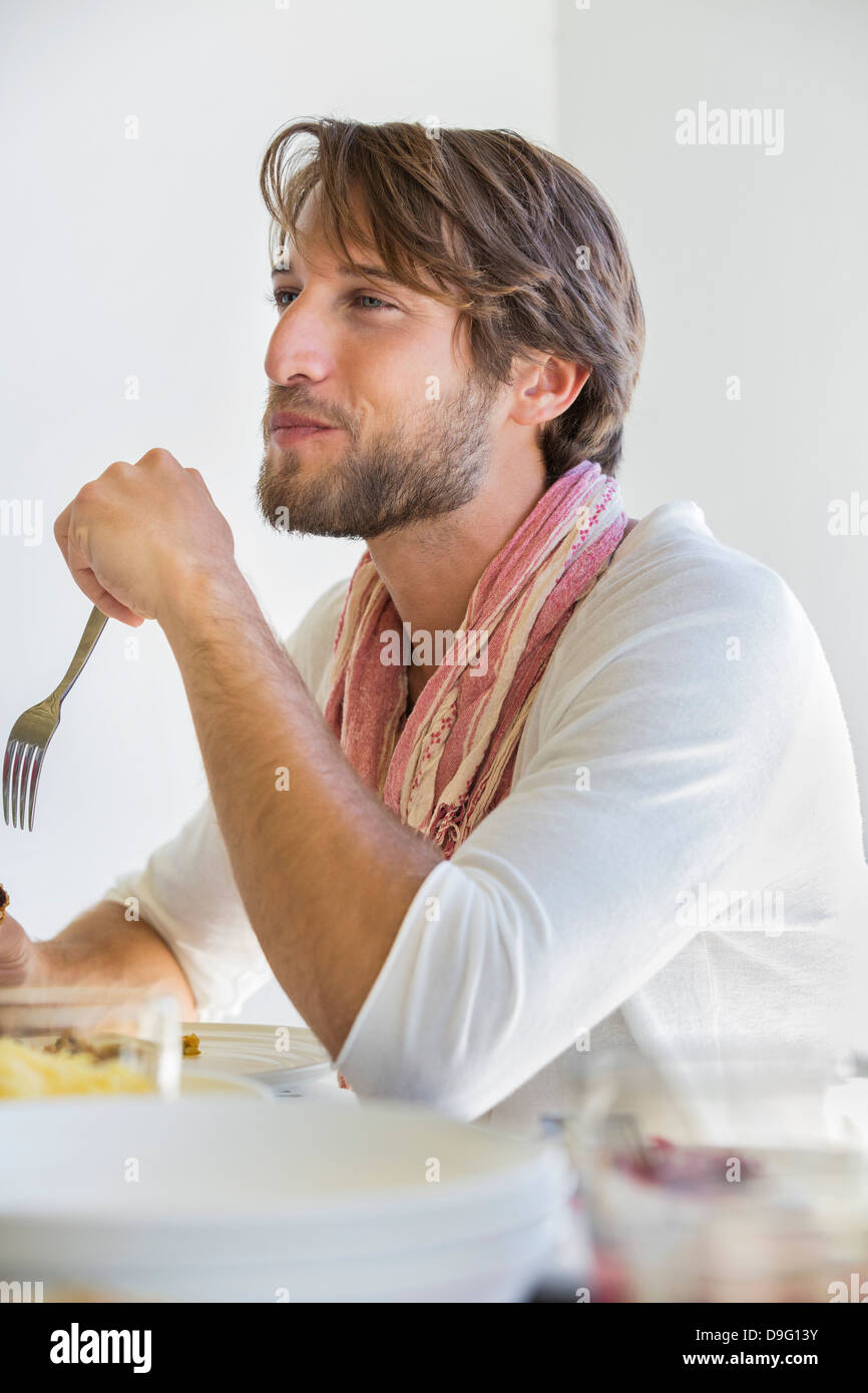 Man at dining table Stock Photo - Alamy