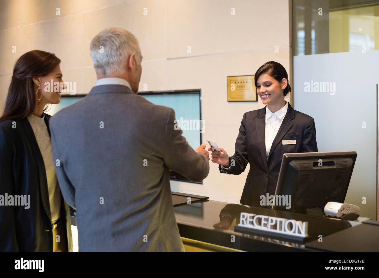 Couple luxury hotel check in hi-res stock photography and images - Alamy