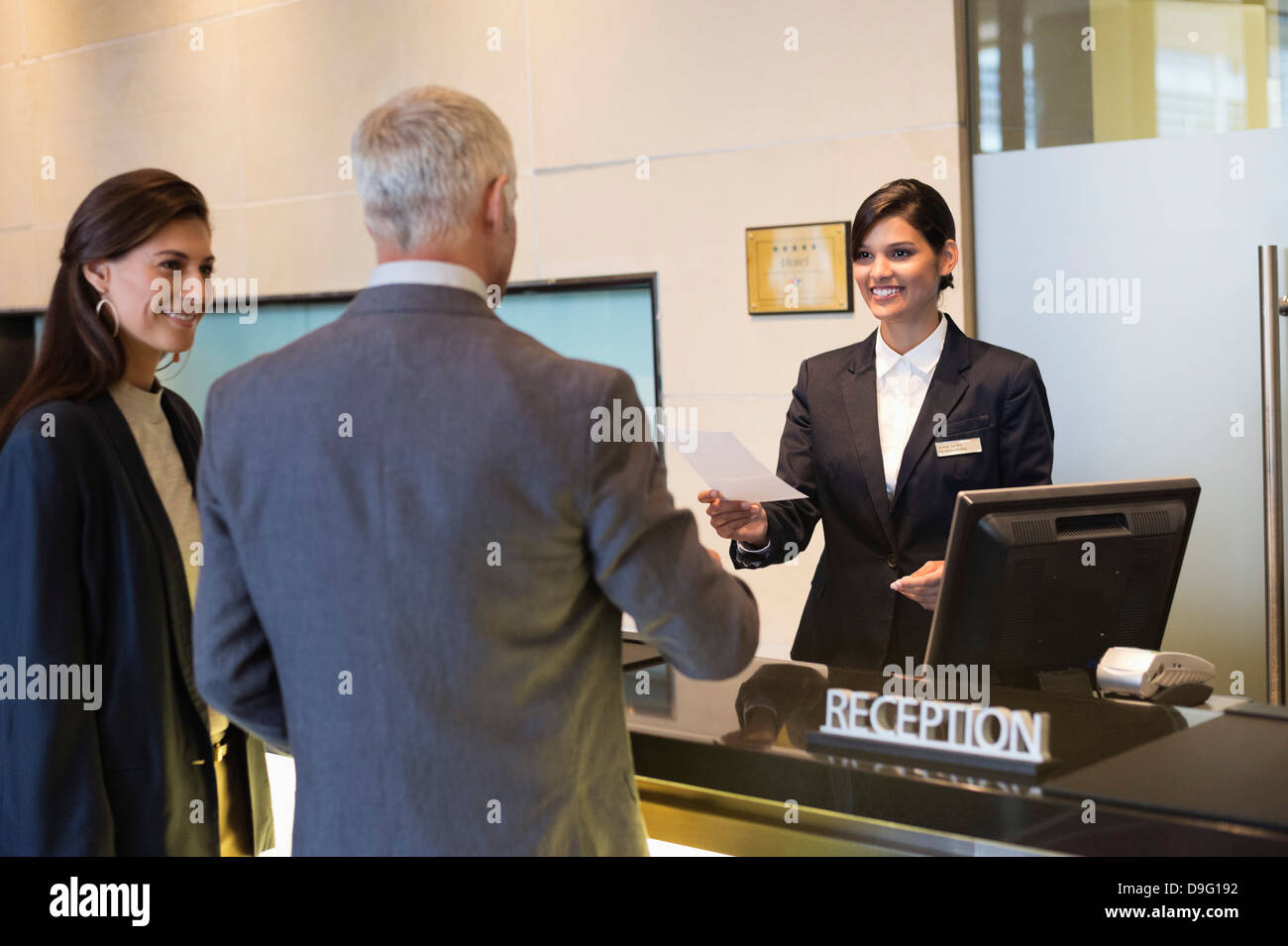 Couple luxury hotel check in hi-res stock photography and images - Alamy