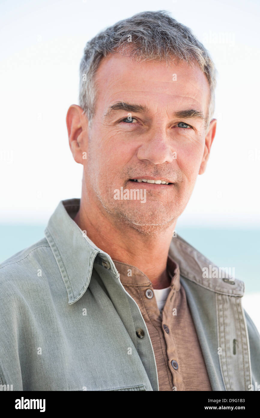 Portrait of a man smiling on the beach Stock Photo - Alamy