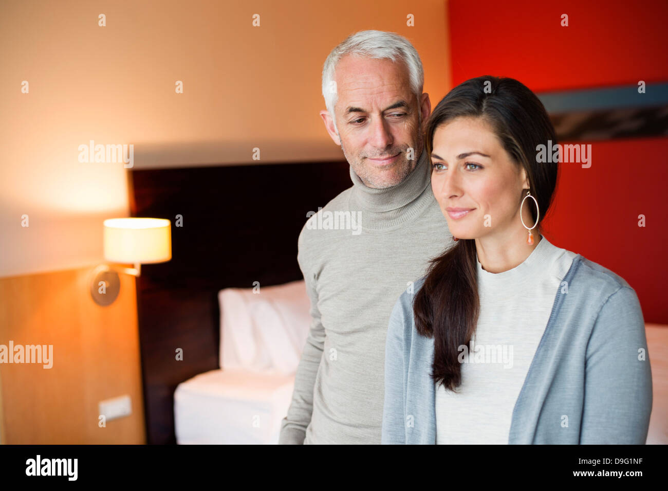 Couple smiling in a hotel room Stock Photo - Alamy