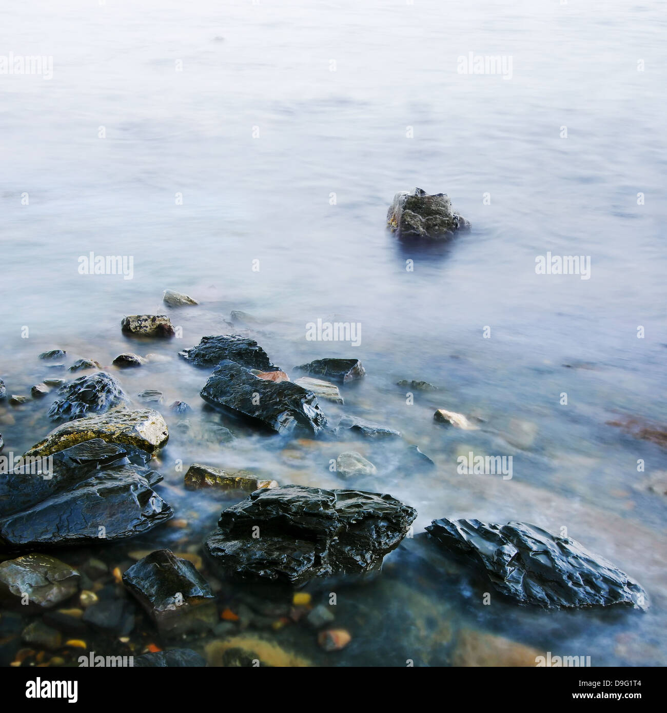 Stones in water Stock Photo - Alamy