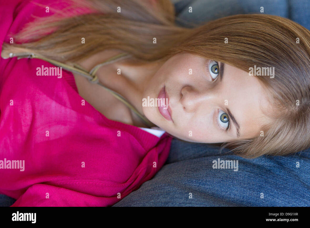 Portrait of a girl lying down Stock Photo - Alamy