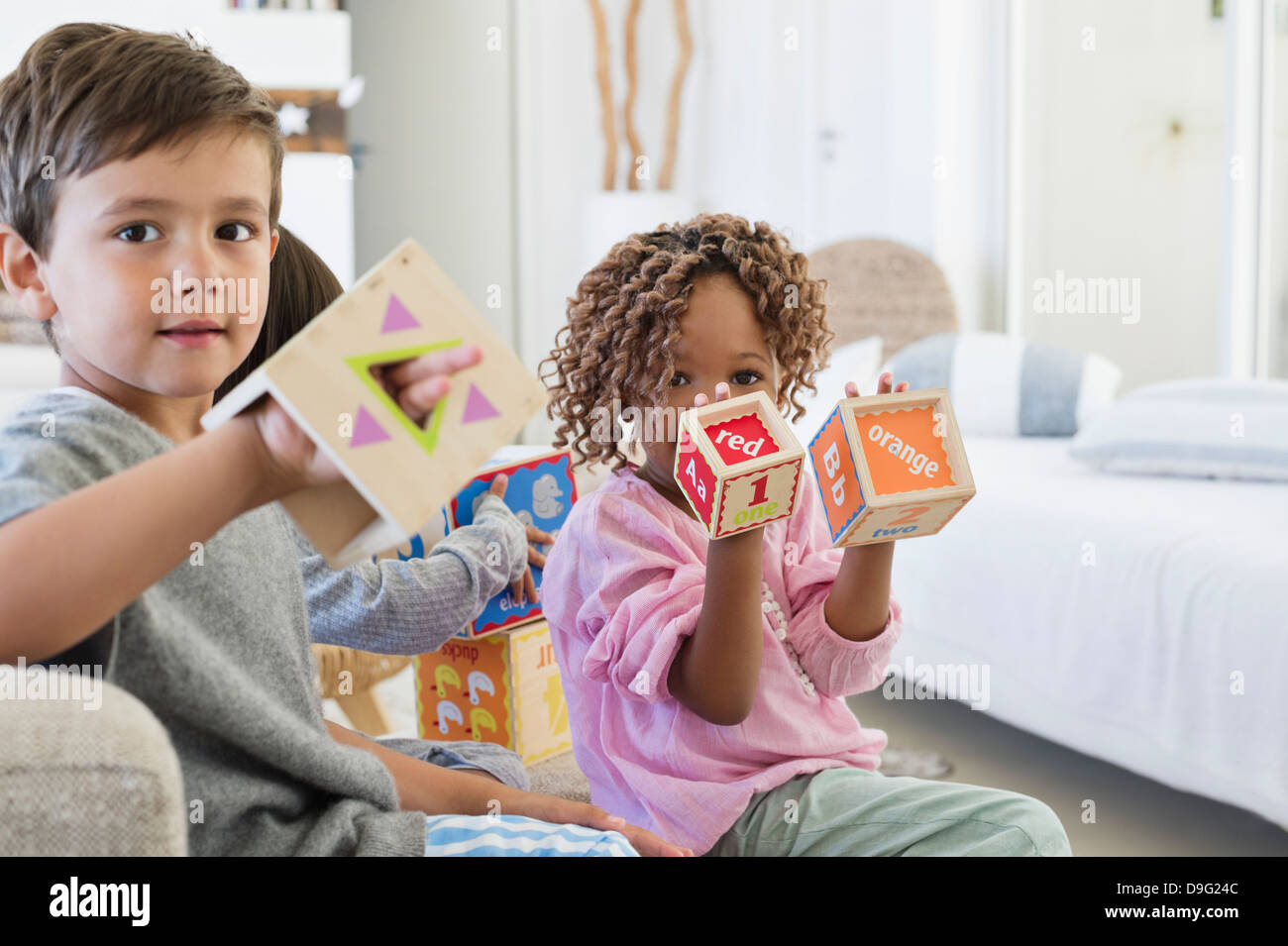 Children playing with number blocks Stock Photo - Alamy