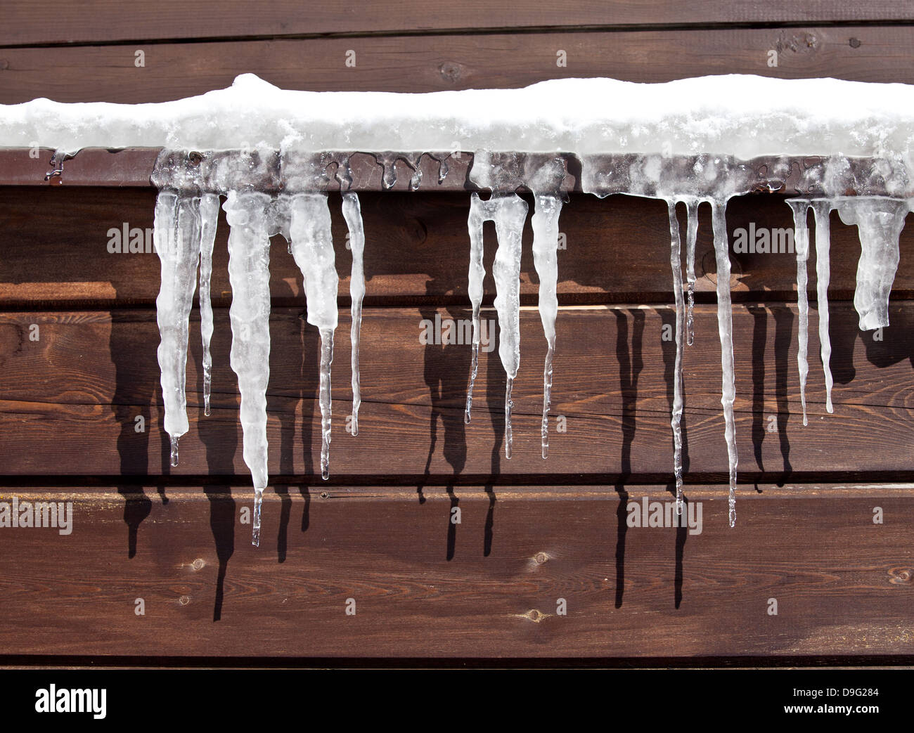 Icicles on Log Cabin Stock Photo - Alamy