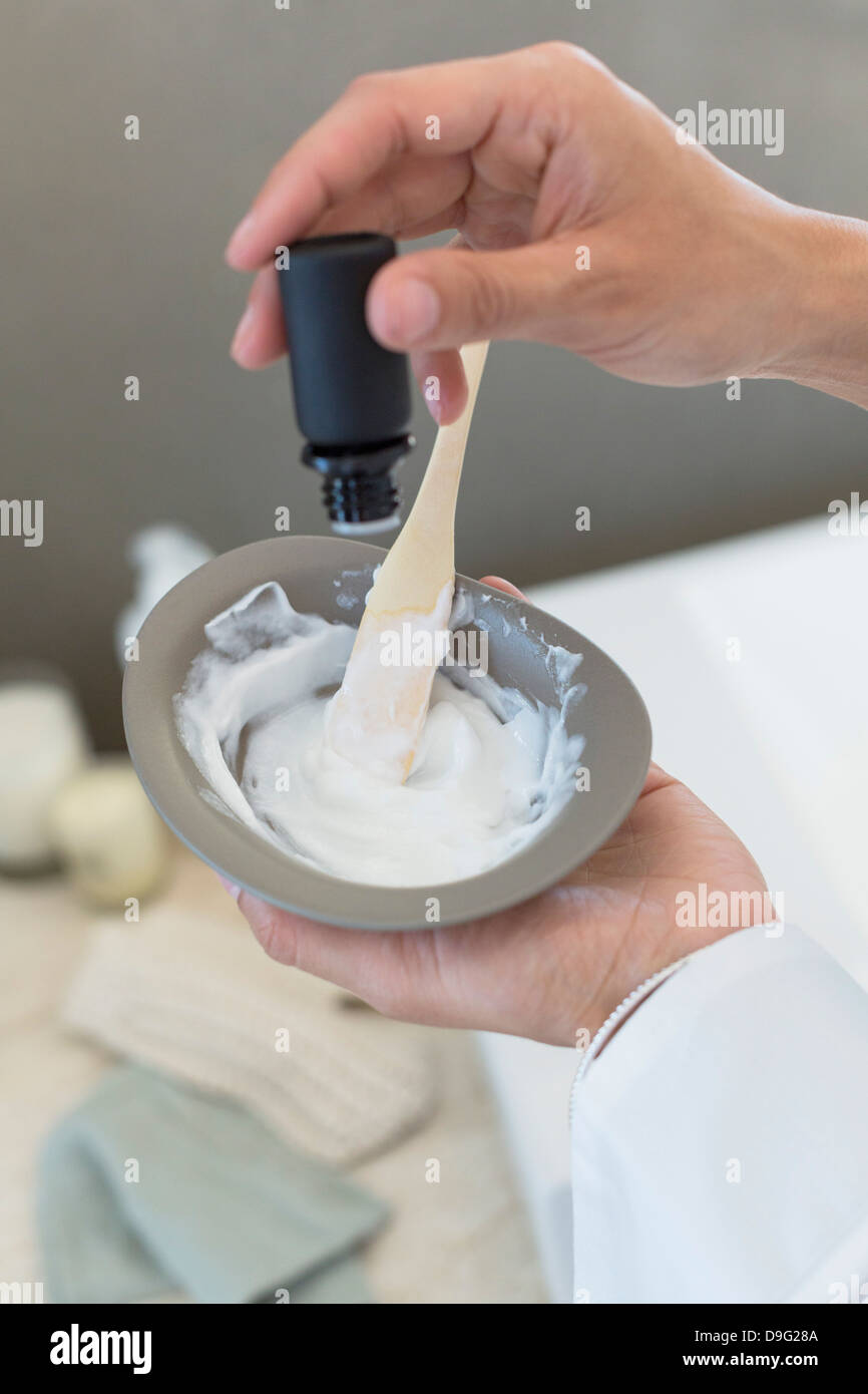 Woman preparing hair dye Stock Photo - Alamy