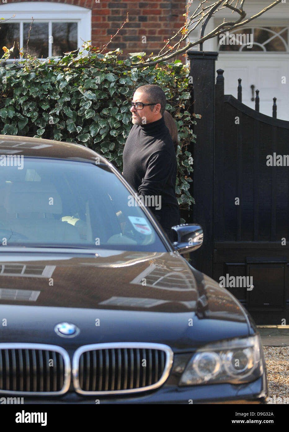 George Michael is picked up by a chauffeur driven BMW outside his house ...