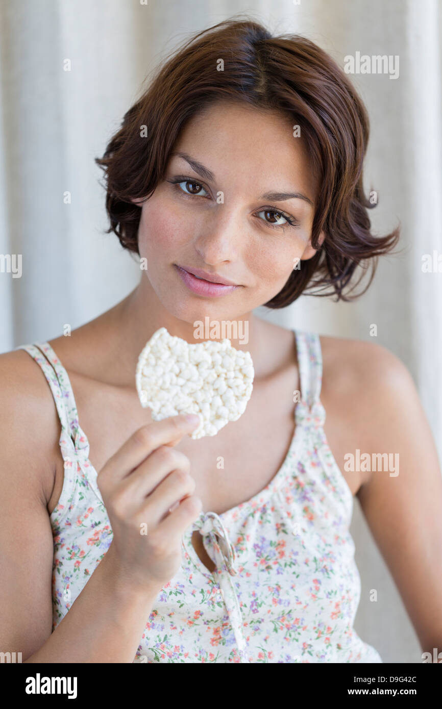 Woman eating rice cake hi-res stock photography and images - Alamy