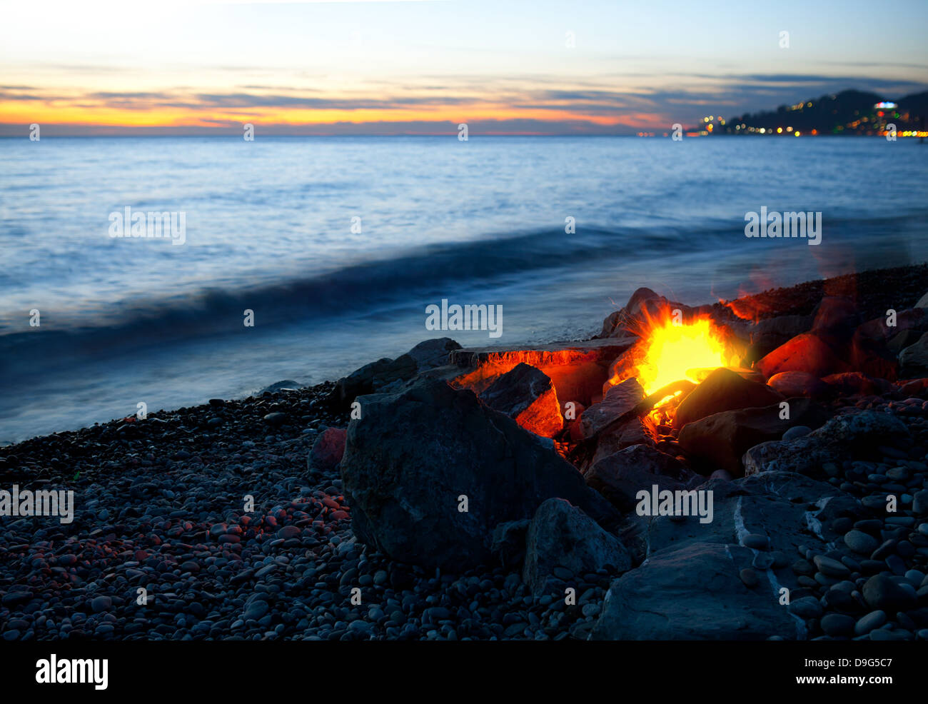 Bonfire on the beach, sunset Stock Photo - Alamy