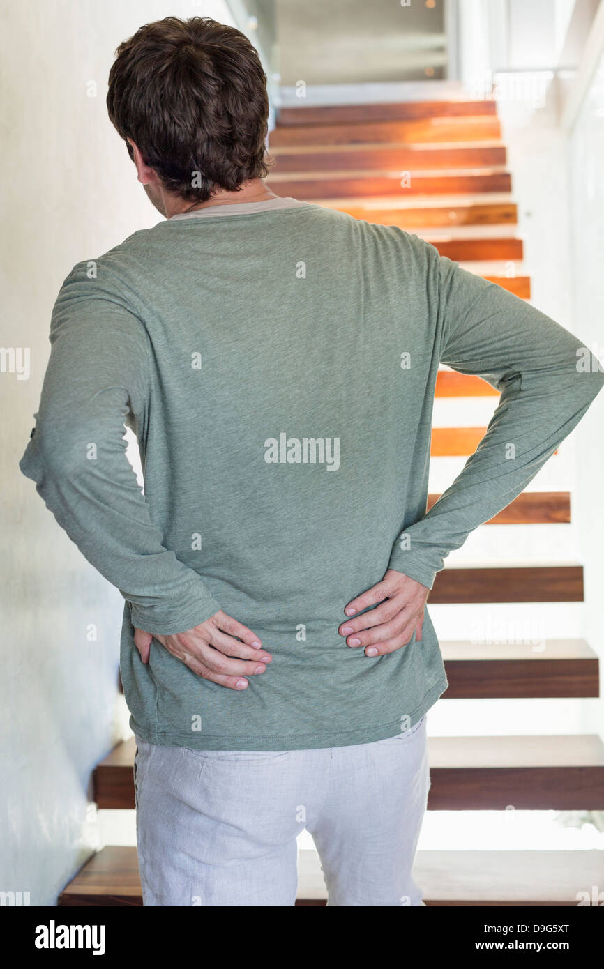 Man suffering from backache Stock Photo - Alamy