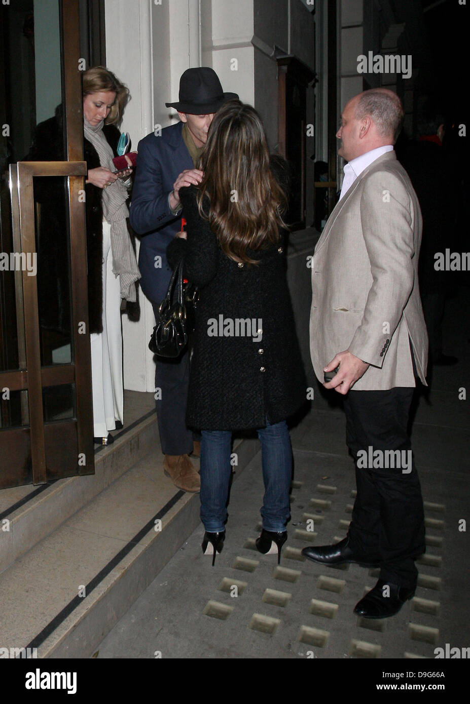 Liz Hurley kisses her companion when leaving the Royal Opera House ...