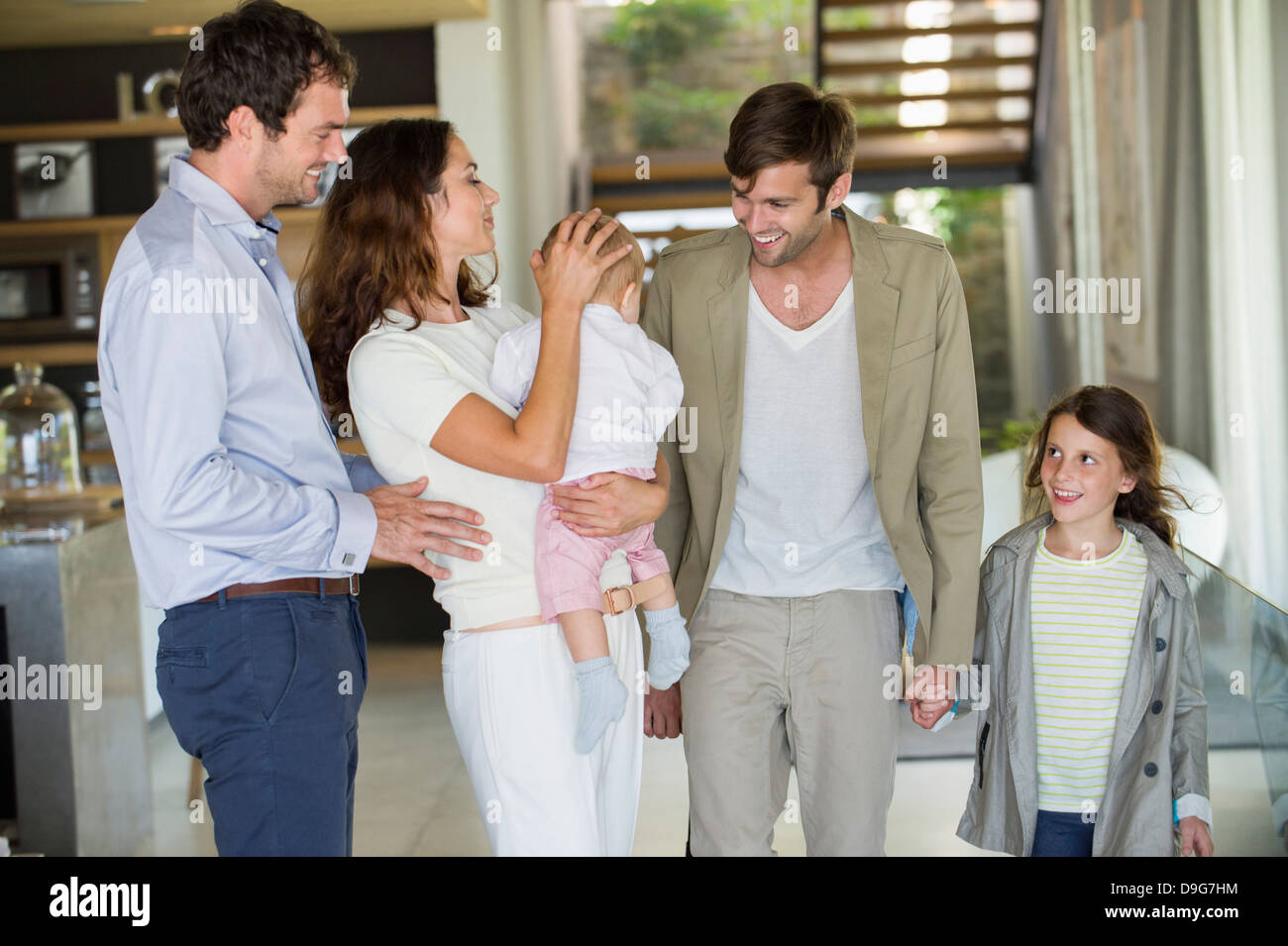Parents with their children at home Stock Photo - Alamy