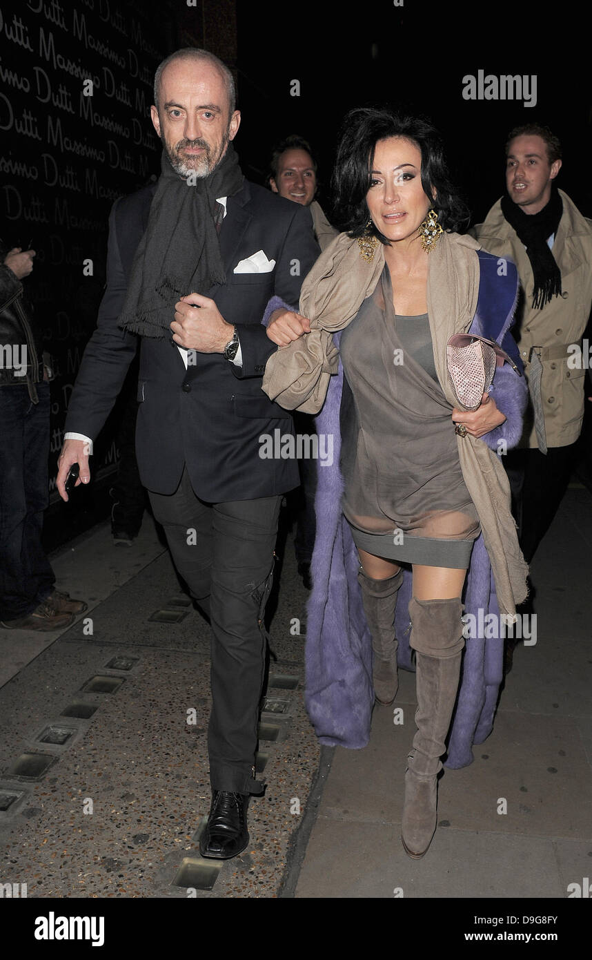 Nancy Dell'Olio and a male companion walking in Soho. London, England ...