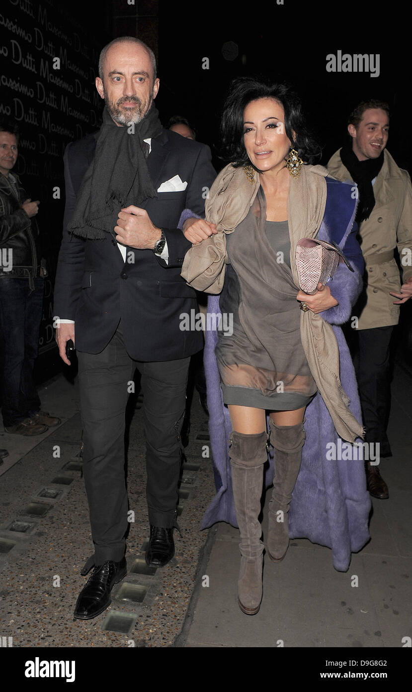 Nancy Dell'Olio and a male companion walking in Soho. London, England ...