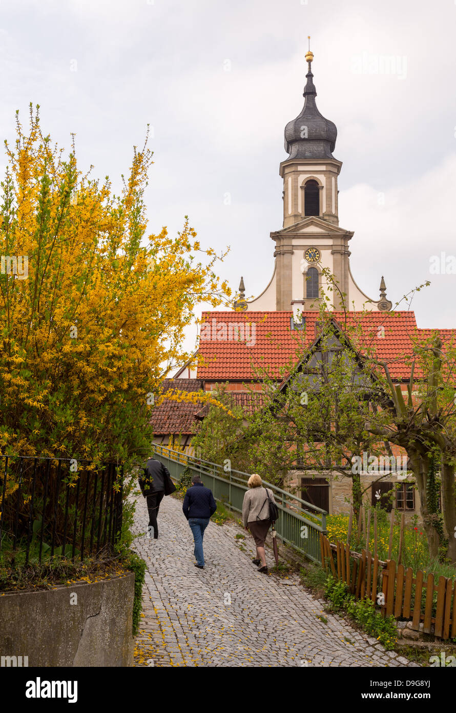 Church St Johannis or Johannes in Castell Germany with three people ...