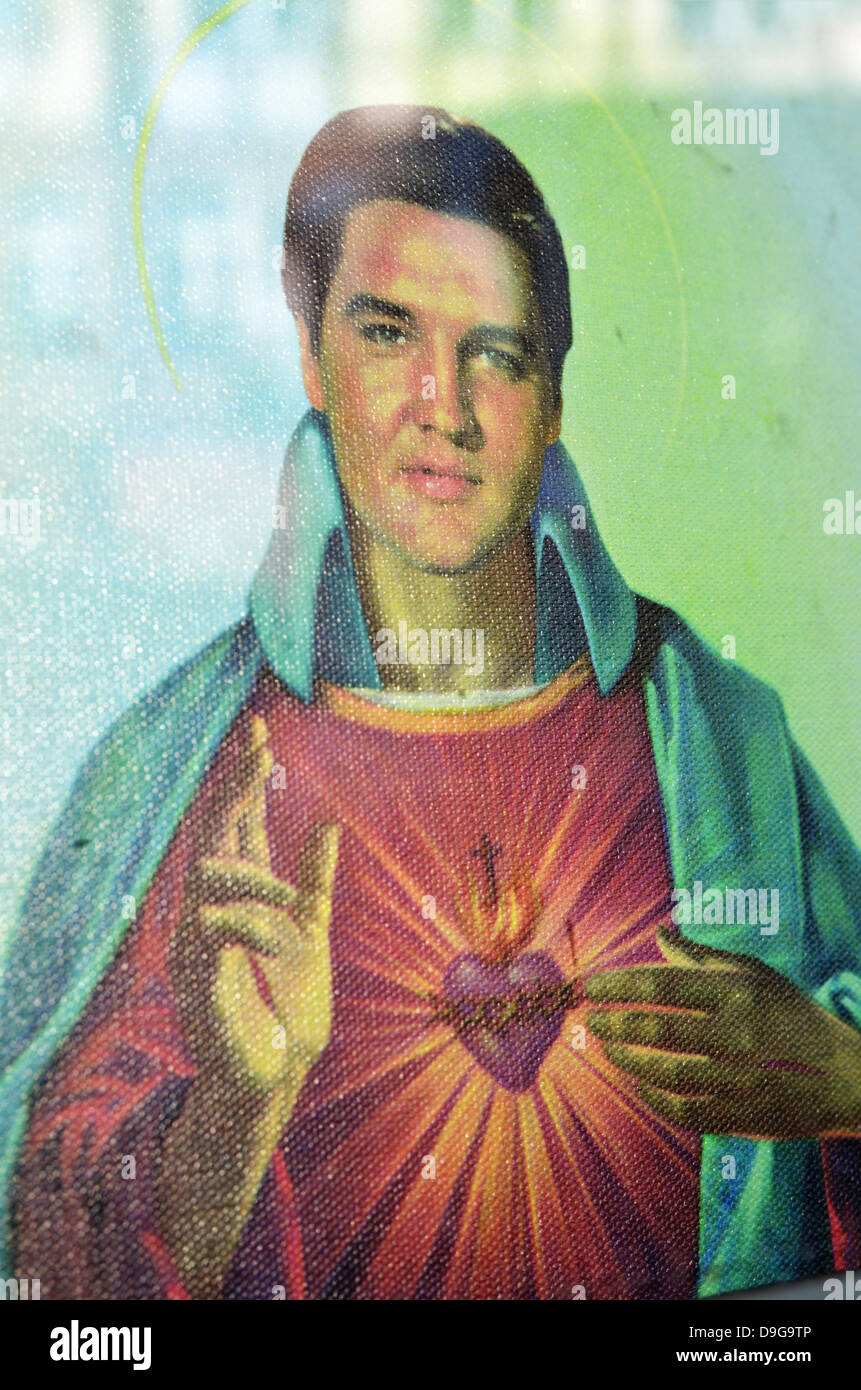 Saint Elvis painting with window reflection on Nuremberg street ...