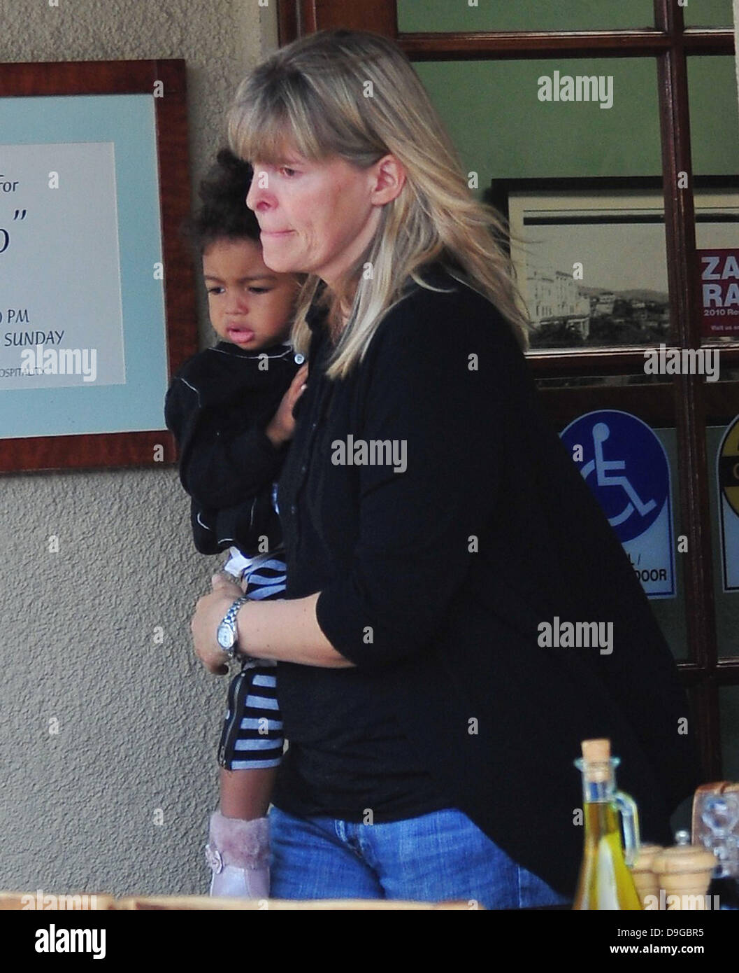 Johan Samuel being carried while out an about in Brentwood Los Angeles ...