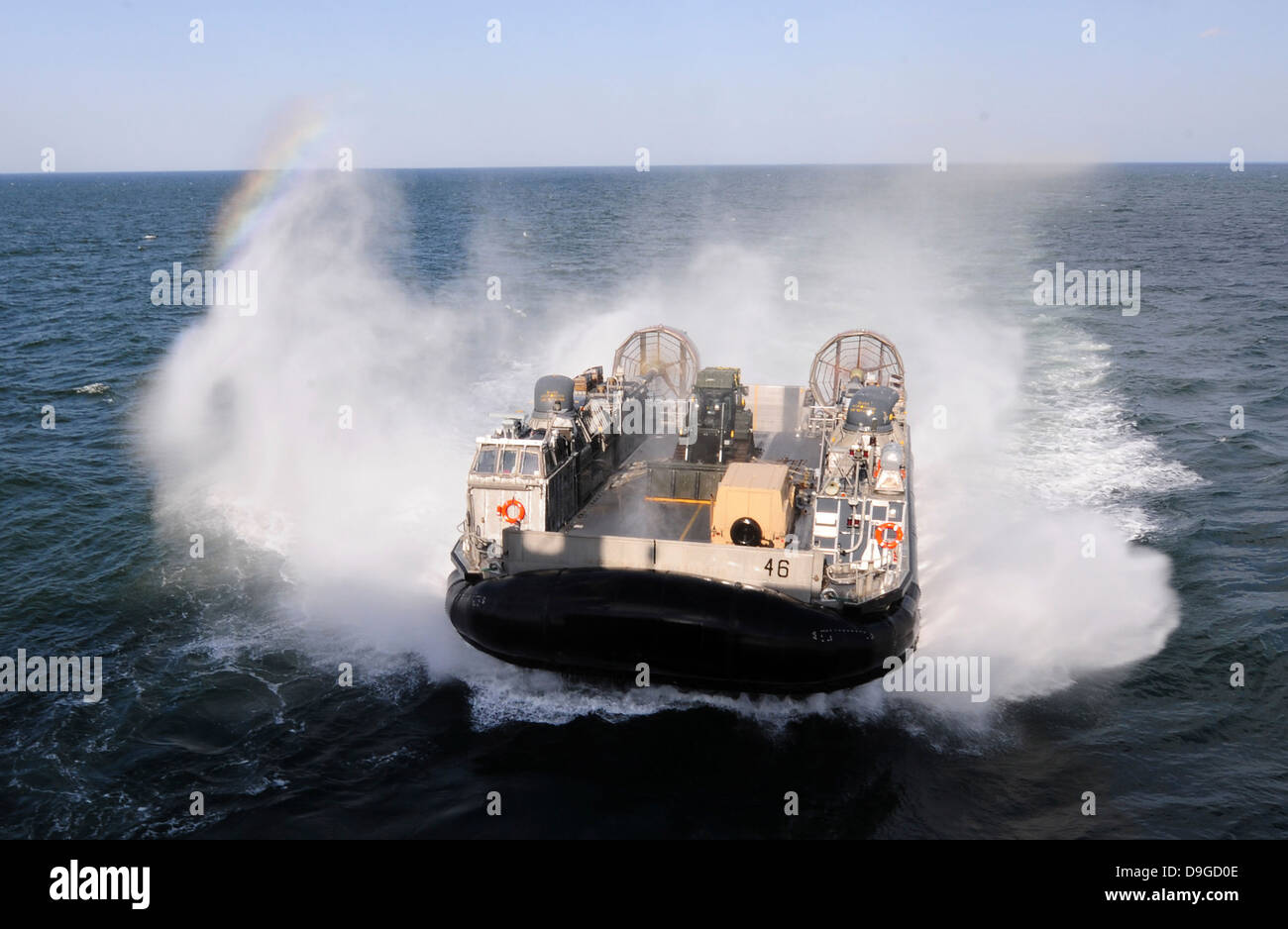 A landing craft utility from Assault Craft Unit 2 transits at high ...