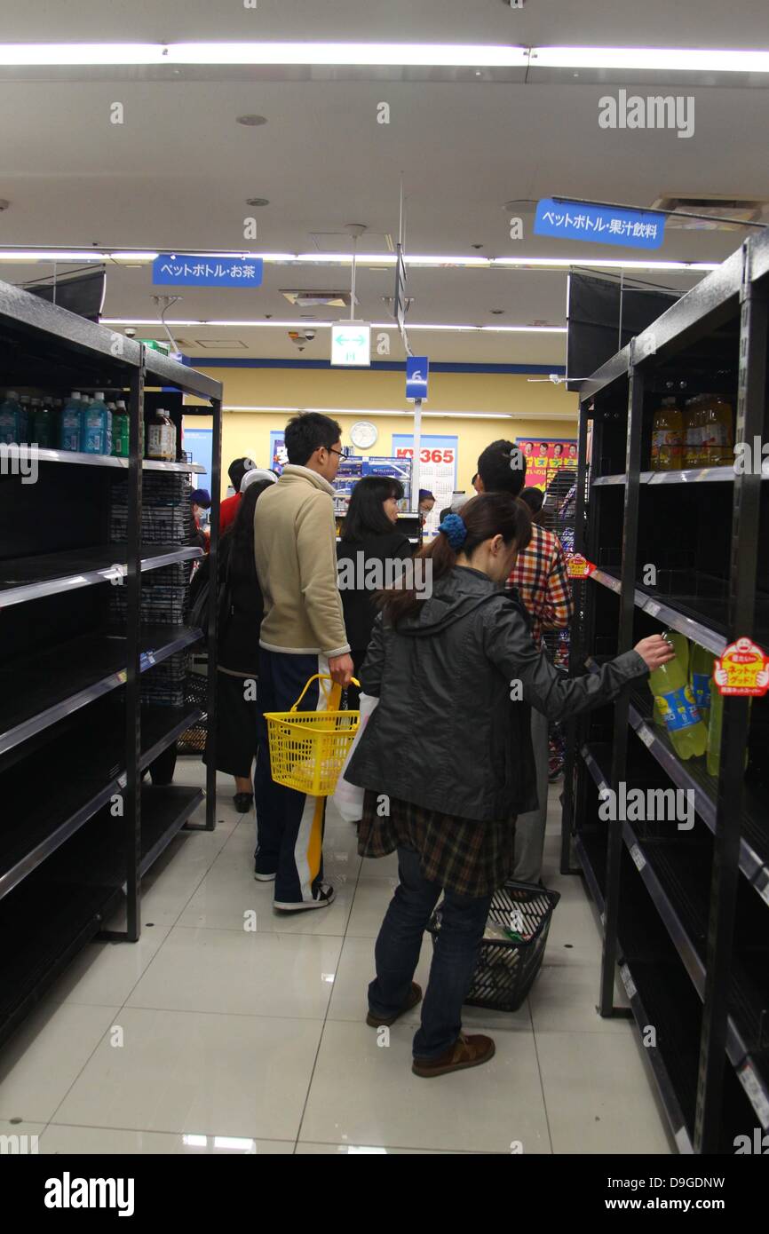 Food racks are emptied at a local supermarket in Tokyo on Monday, March ...