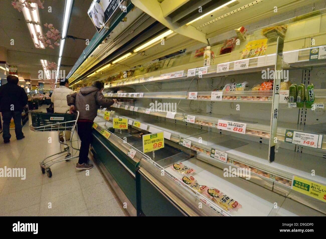 Food racks and shelvs are emptied at a local supermarket in Funabashi ...