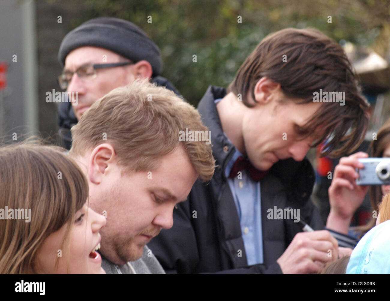 James Corden and Matt Smith sign autographs while taking a break from ...