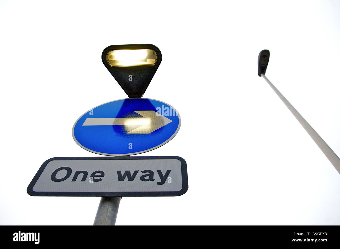 One way road traffic sign against white background Stock Photo - Alamy