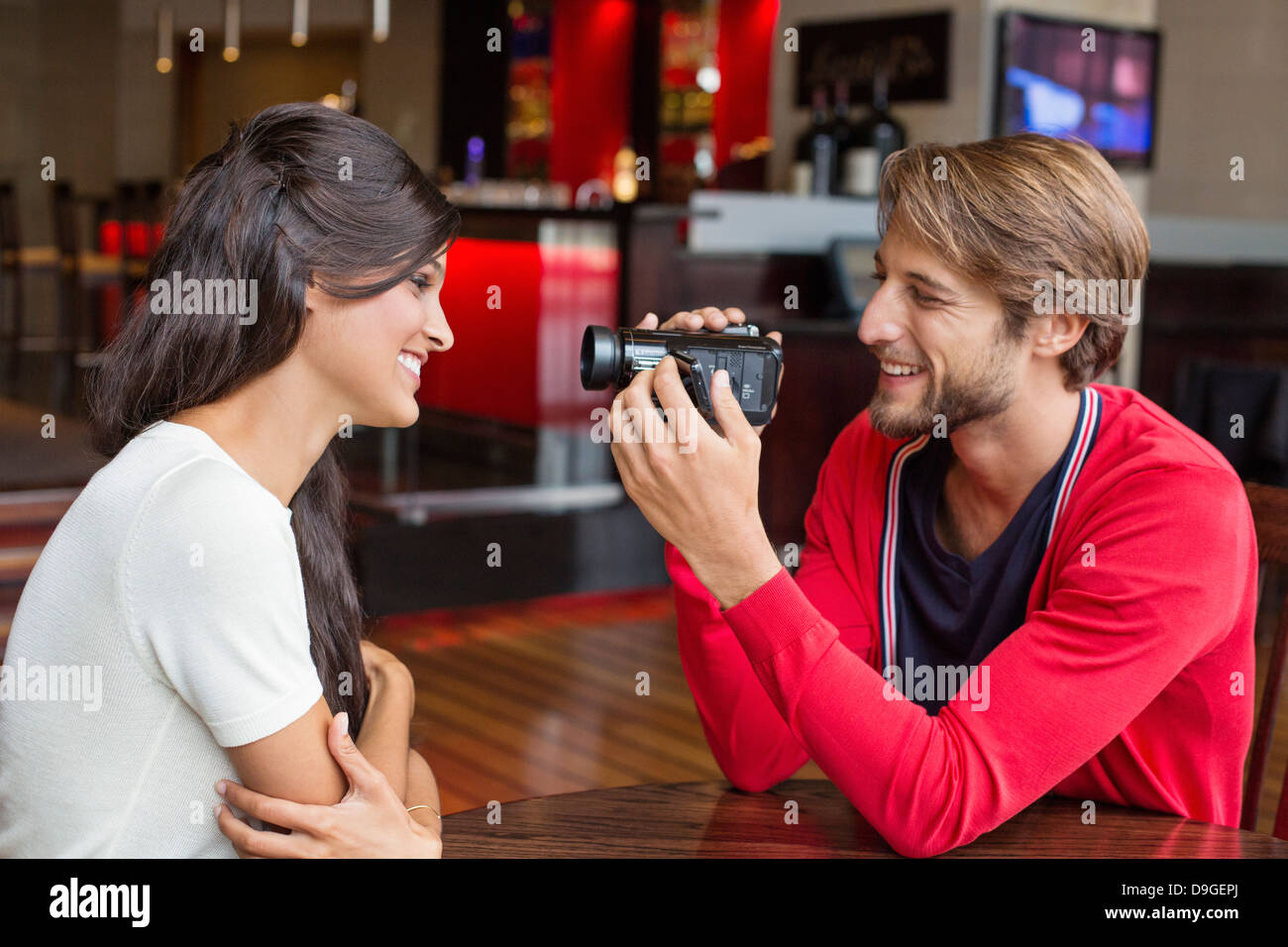 Woman filming video camera boyfriend hi-res stock photography and ...