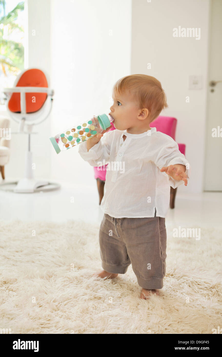Baby boy drinking bottle hi-res stock photography and images - Alamy