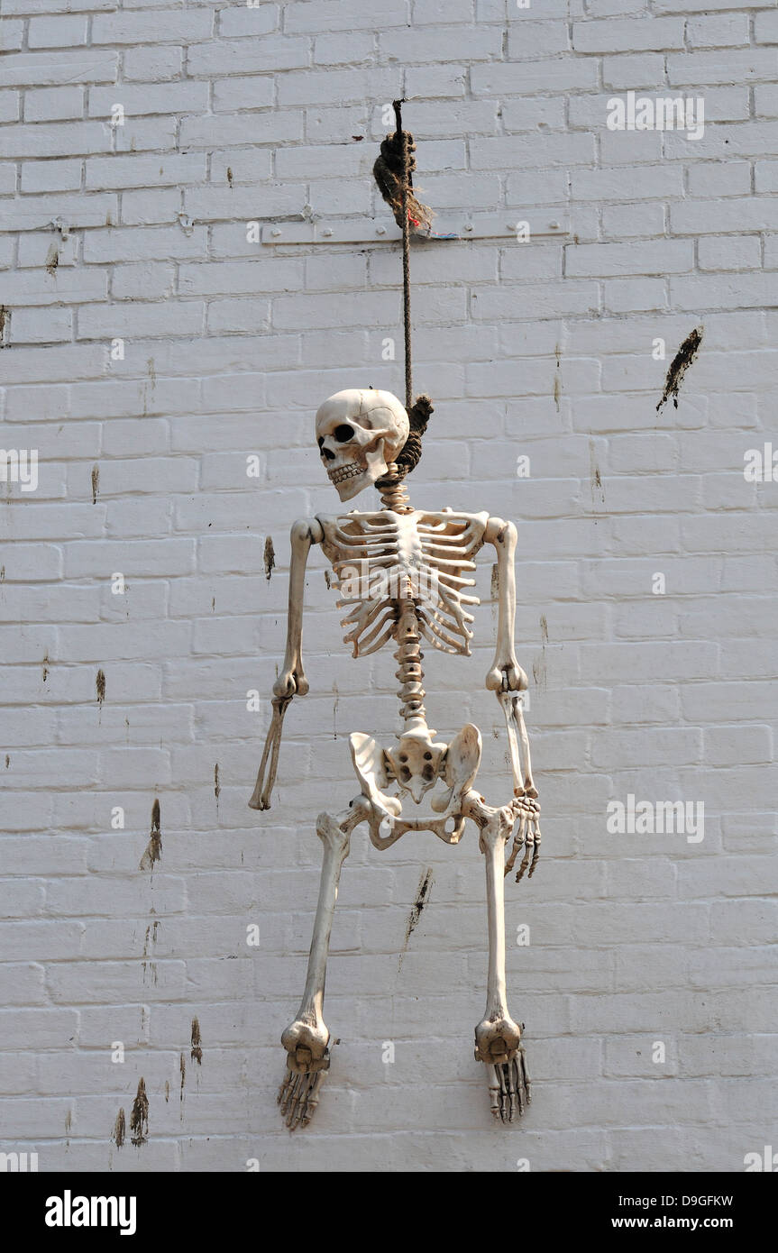 Rye, East Sussex, England, UK. Skeleton hanging from front of a shop ...