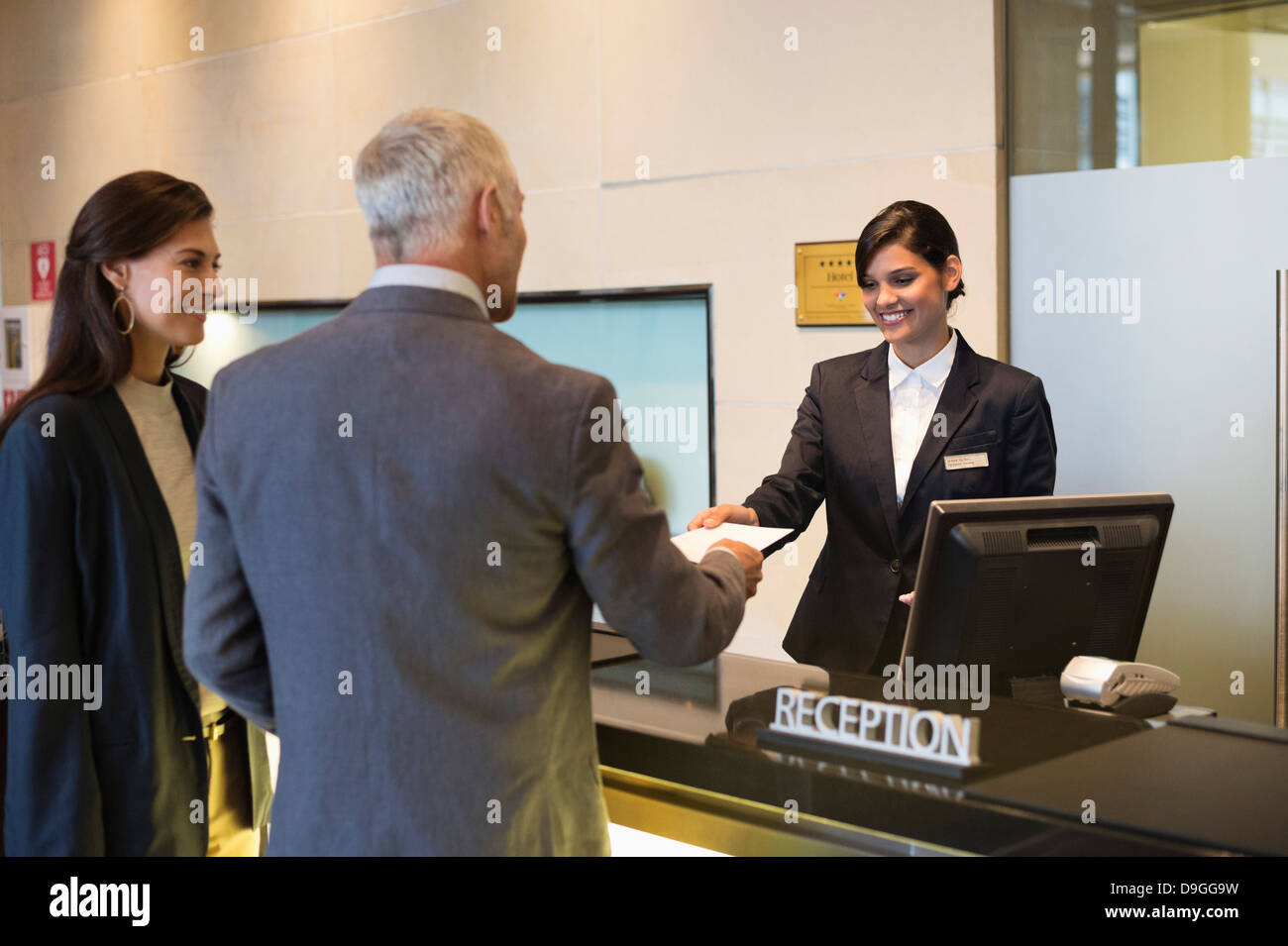 Couple luxury hotel check in hi-res stock photography and images - Alamy
