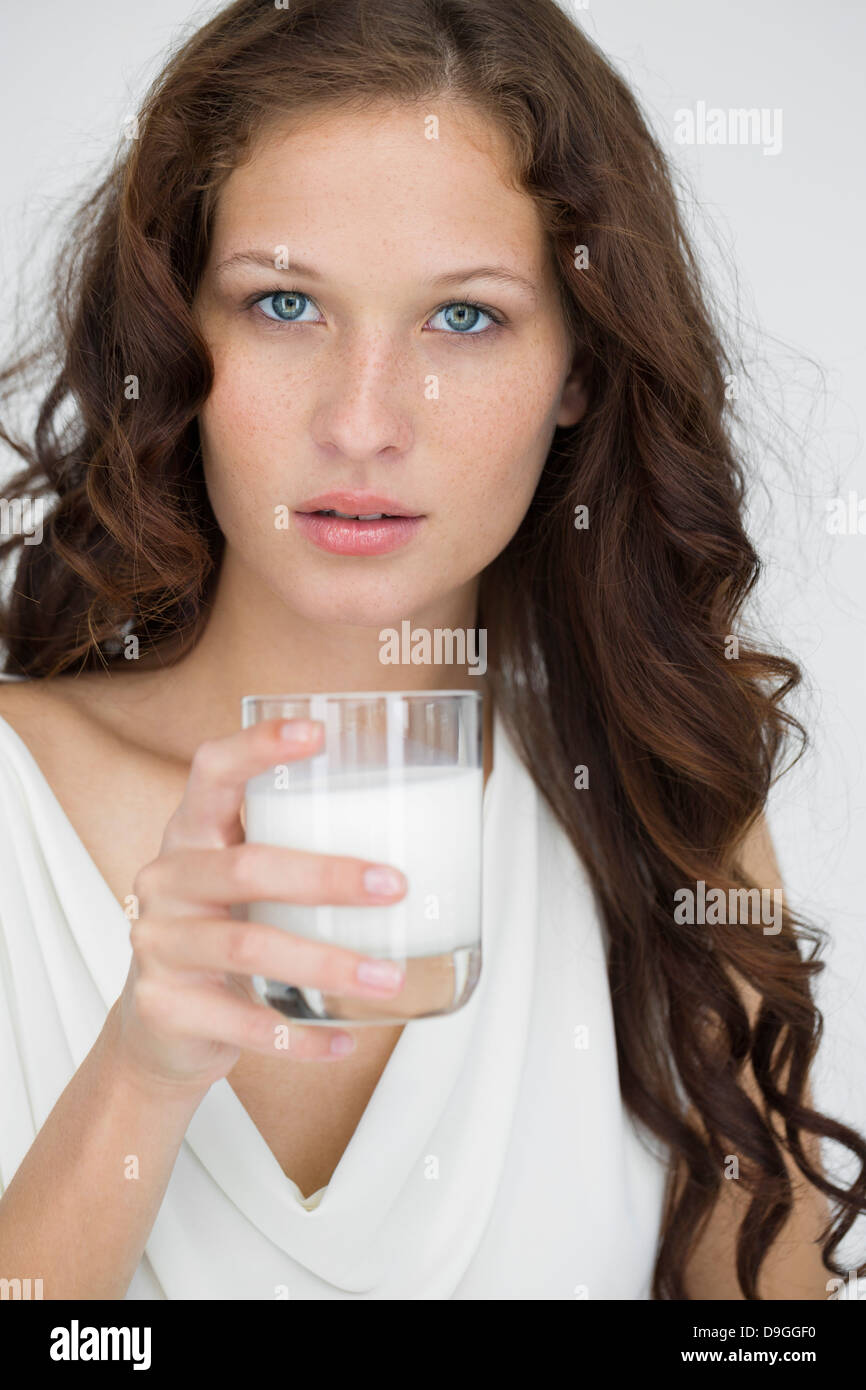 Portrait of a woman drinking milk Stock Photo - Alamy