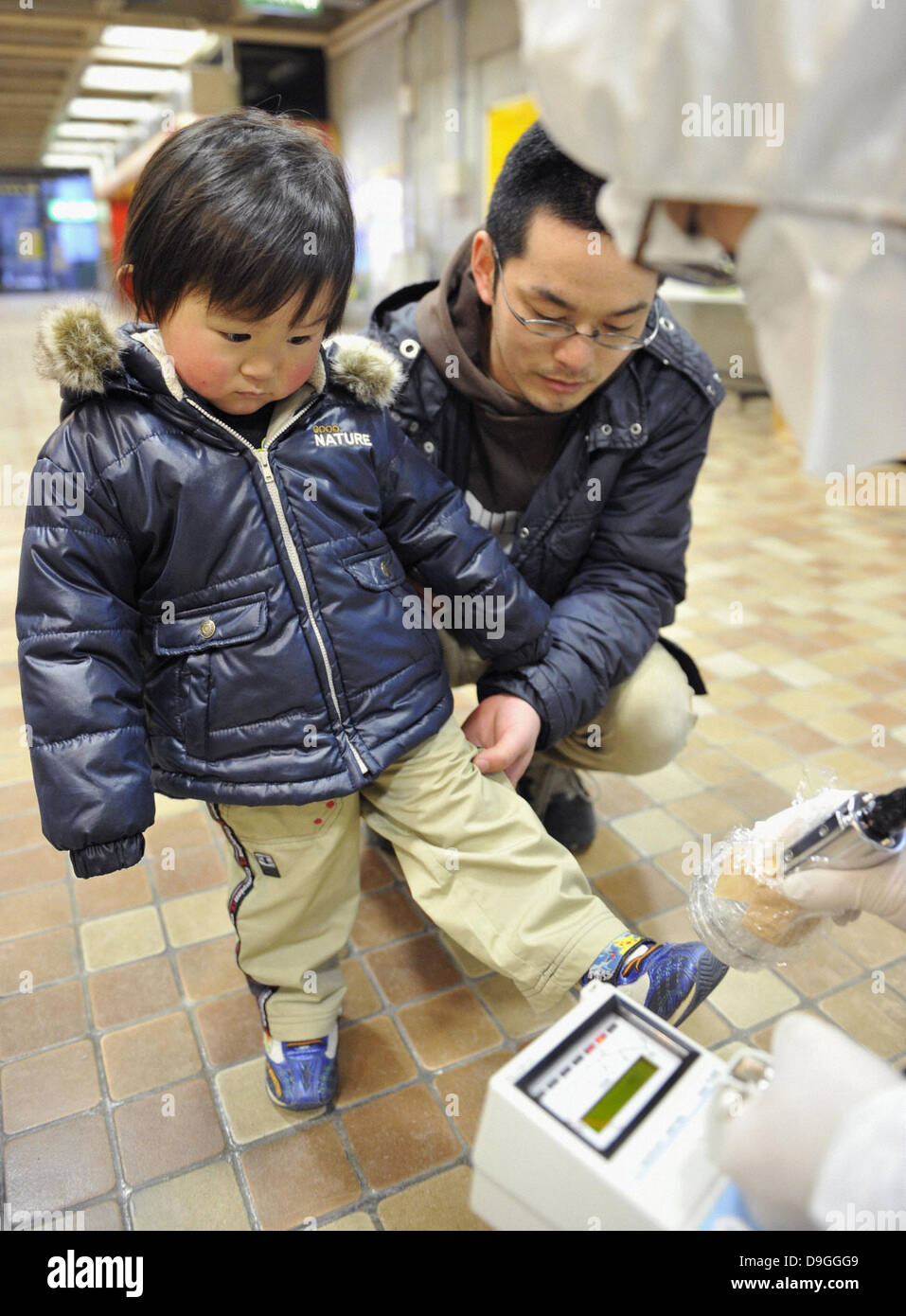 A boy is screened for radiation in Koriyama, Fukushima Prefecture, on ...