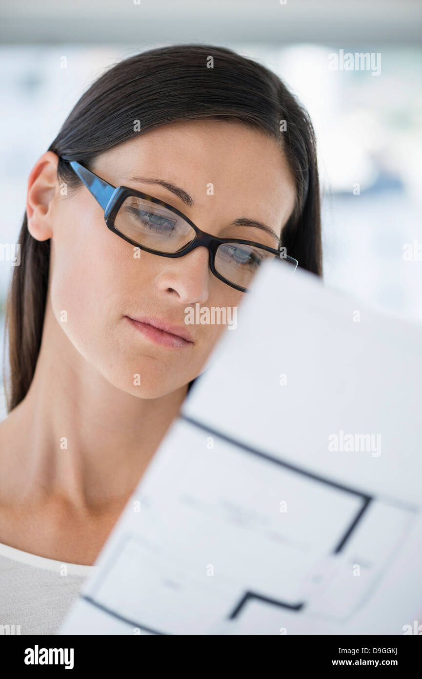 Close-up of a woman reading a document Stock Photo - Alamy