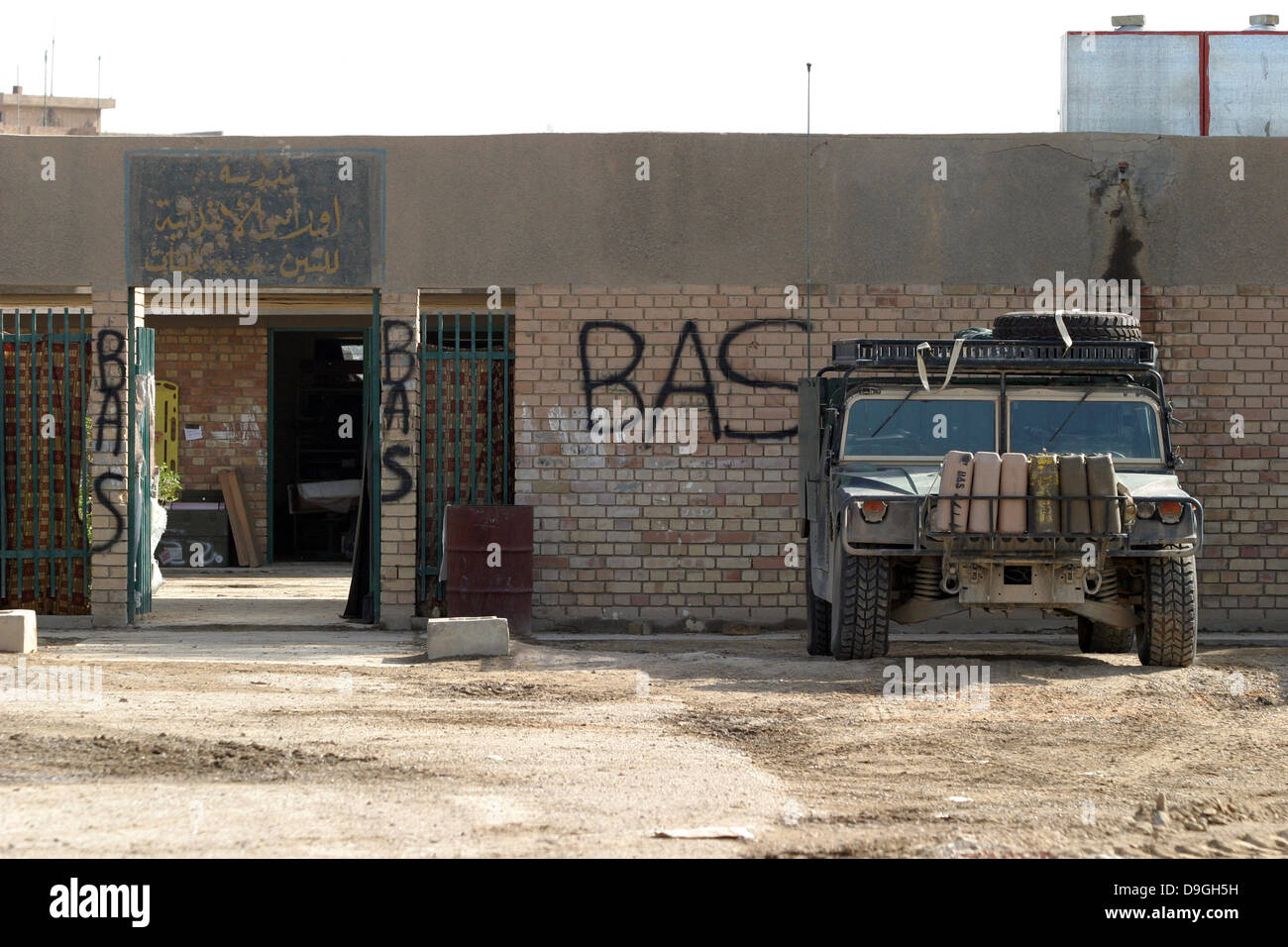 A M998 humvee parked outside an abandoned school Stock Photo - Alamy