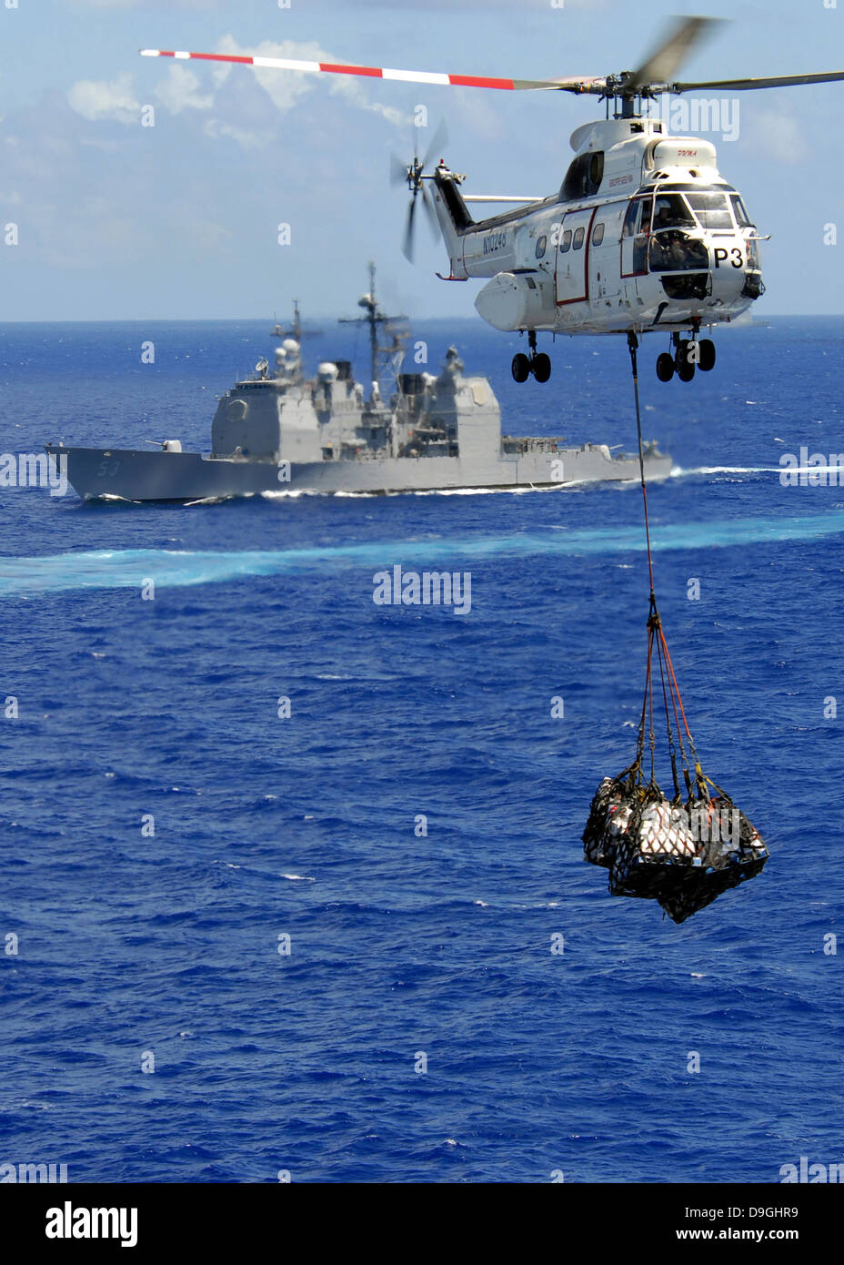 An AS-332 Super Puma helicopter delivering supplies Stock Photo - Alamy