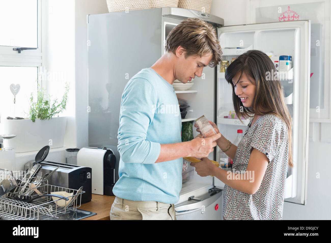 Standing holding food and drink preparation looking down hi-res stock ...