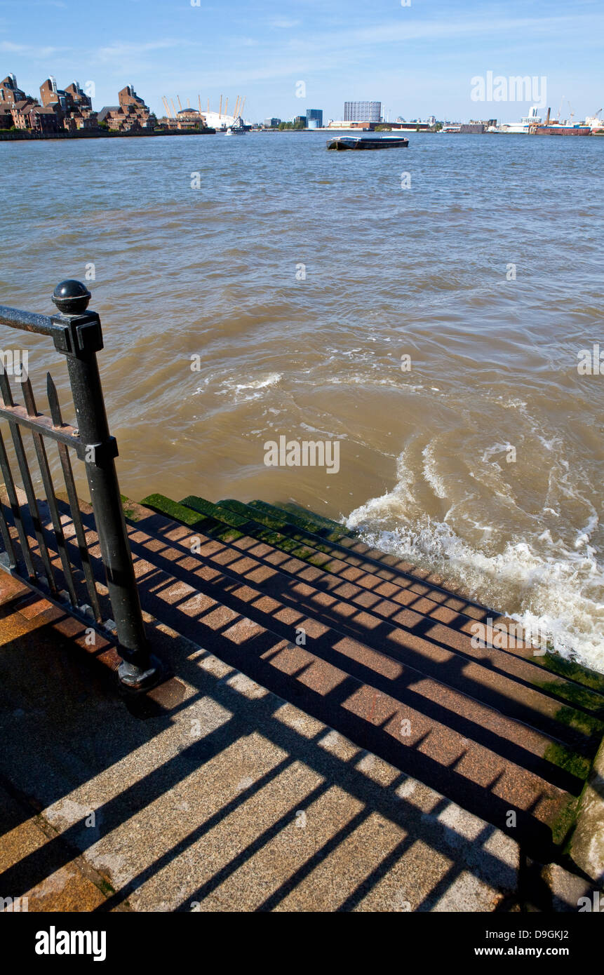 Steps leading down to the River Thames in London. The Millennium Dome ...