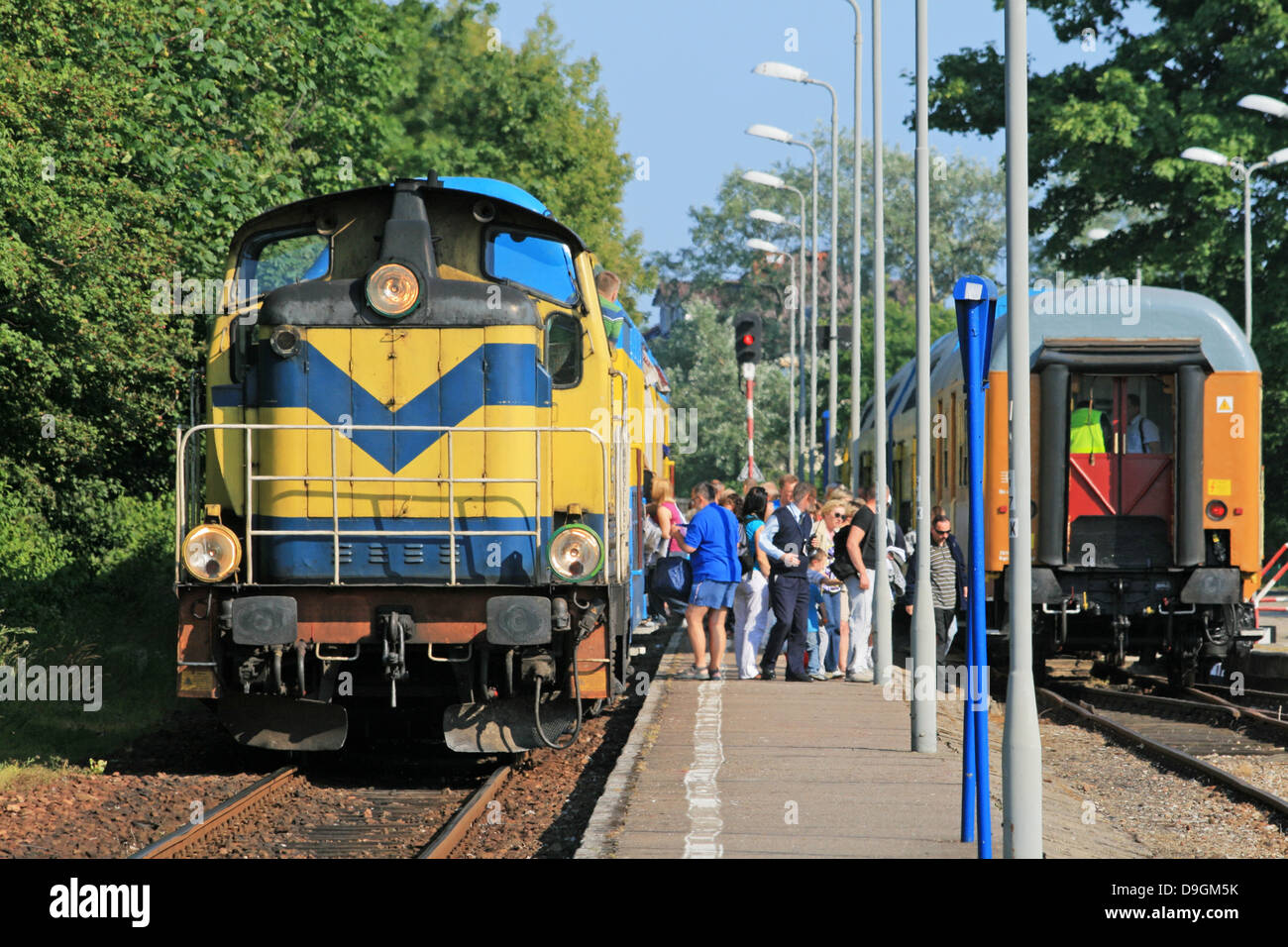Two trains in opposite directions stopped at the small station and the ...