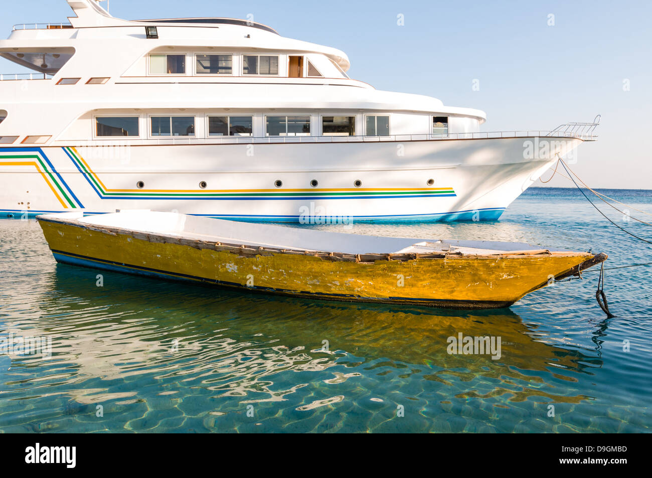 Old boat and modern yacht together in harbour Stock Photo - Alamy