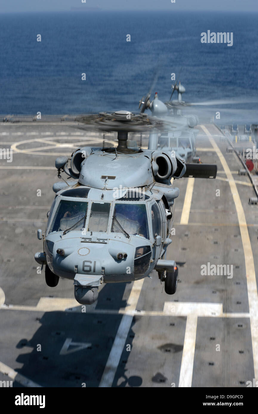 Two MH-60S Sea Hawk helicopters take off from USS Ponce Stock Photo - Alamy