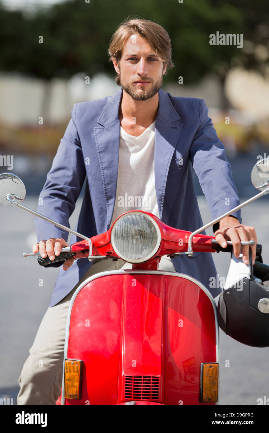 Man riding a scooter Stock Photo - Alamy